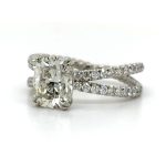 Cushion-Cut Diamond Ring with an X-Shaped Band Peter Norman