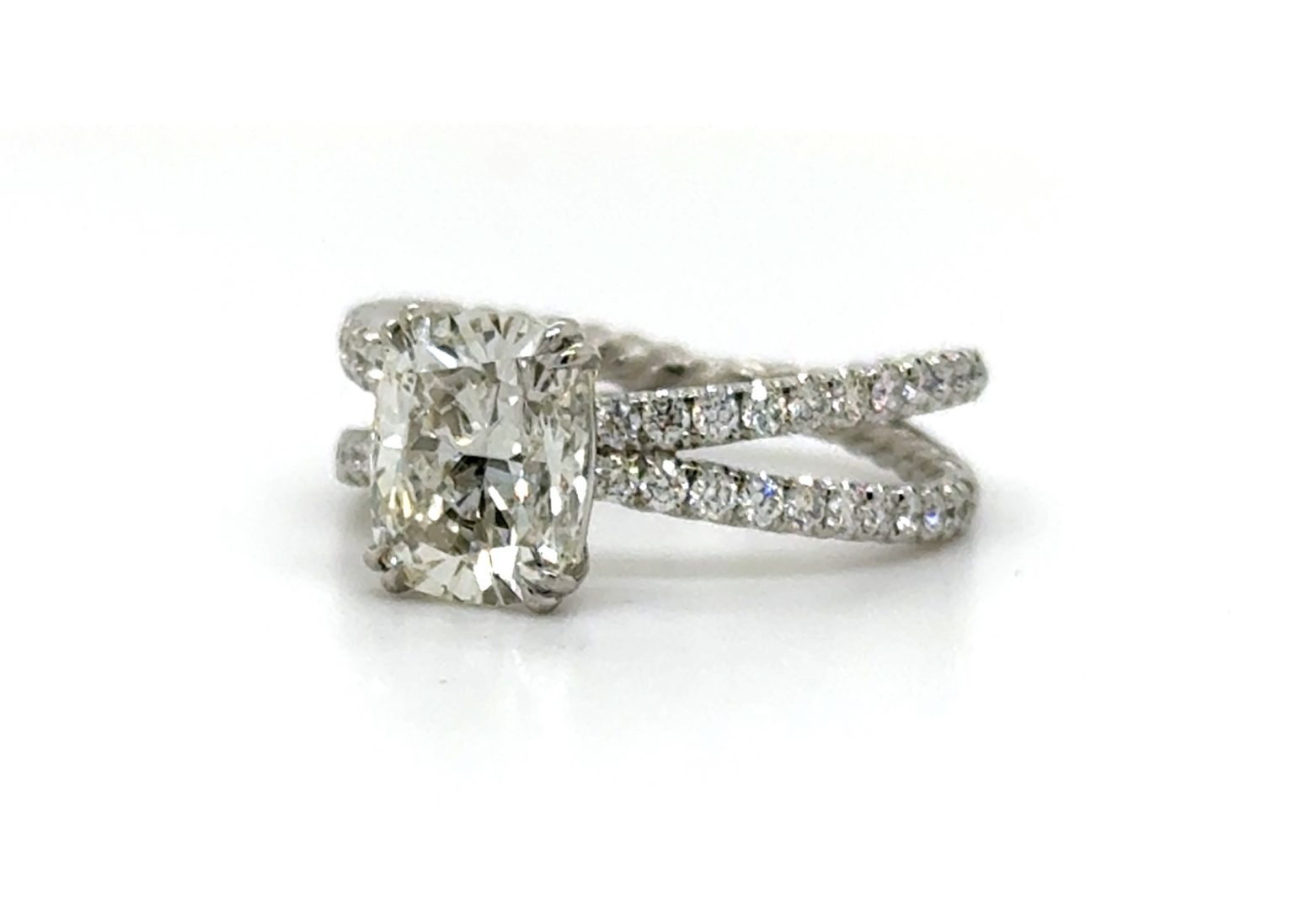 Cushion-Cut Diamond Ring with an X-Shaped Band Peter Norman