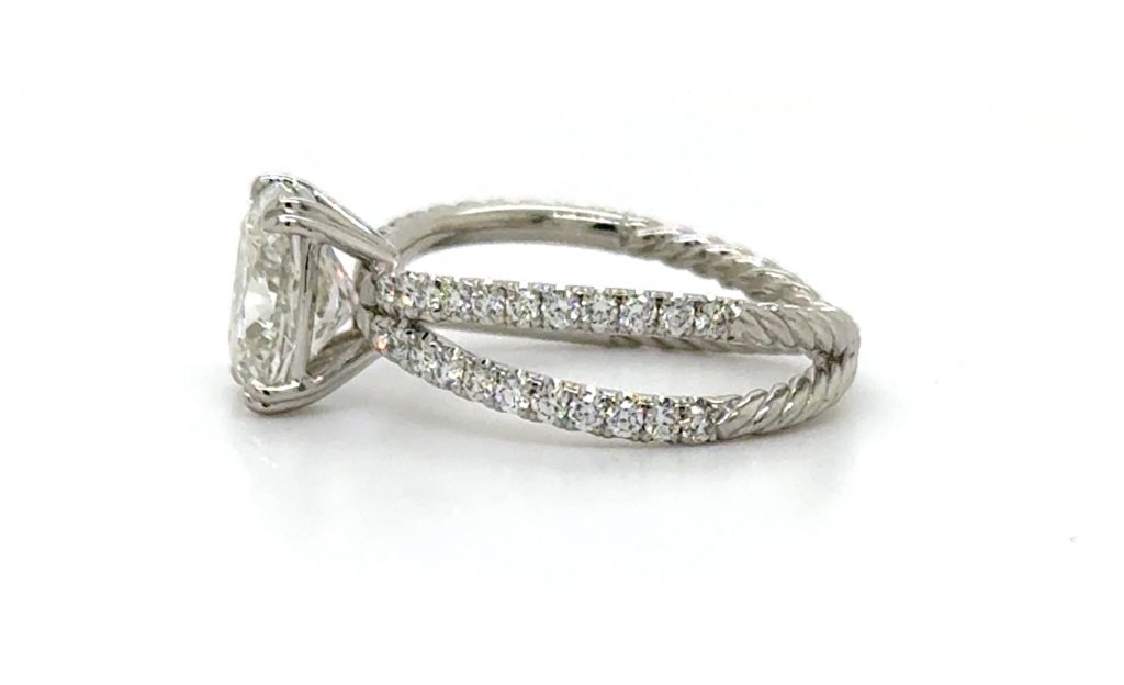 Cushion-Cut Diamond Ring with an X-Shaped Band Peter Norman