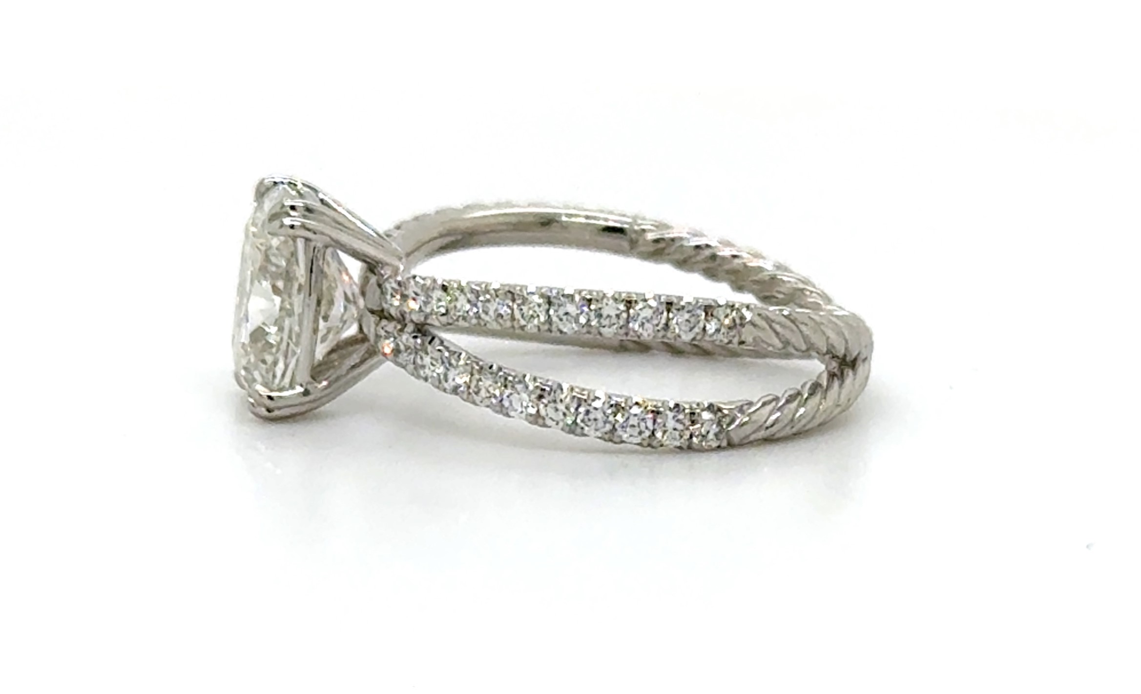 Cushion-Cut Diamond Ring with an X-Shaped Band Peter Norman