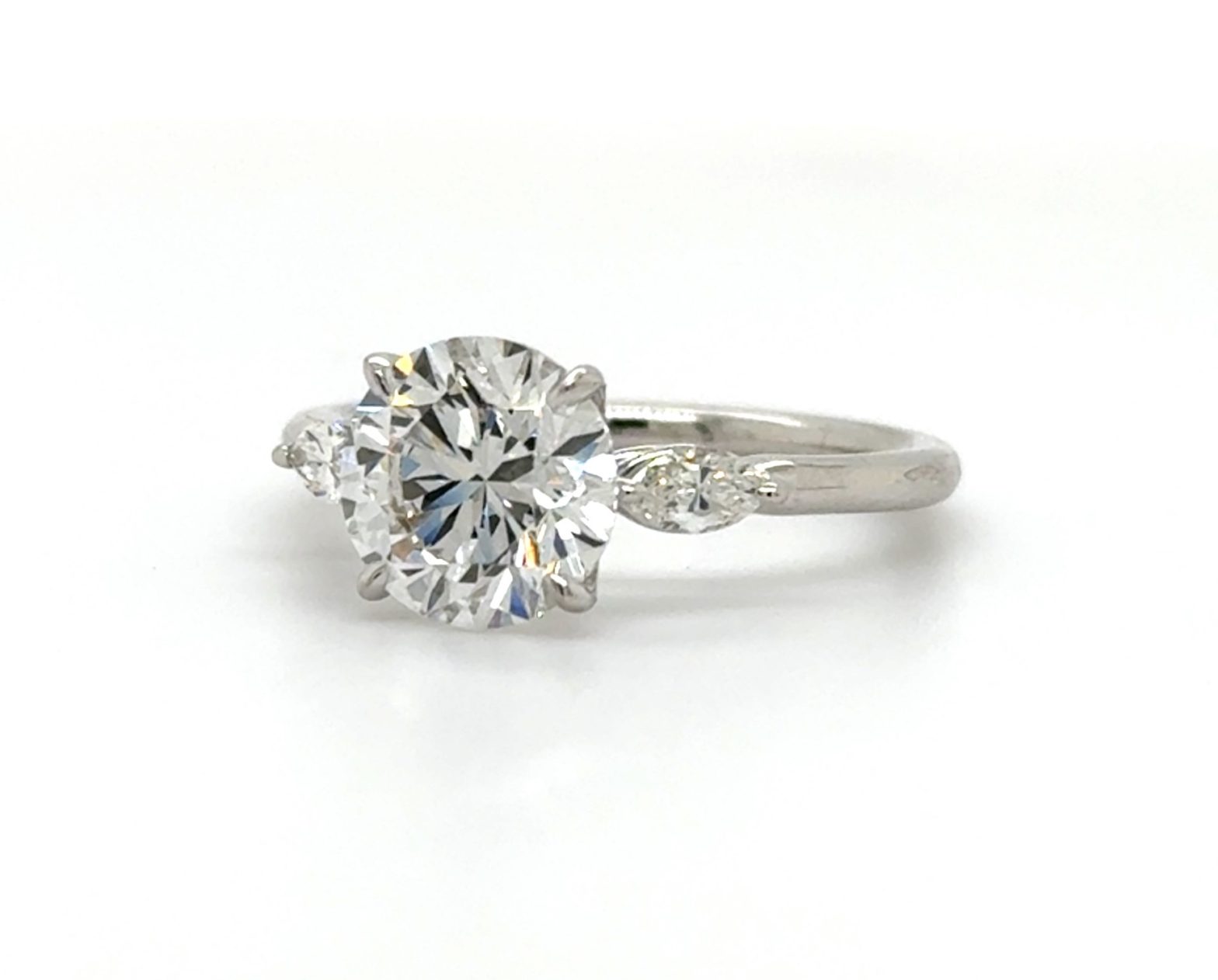 Round and Marquise Diamond Three-Stone Ring | Peter Norman